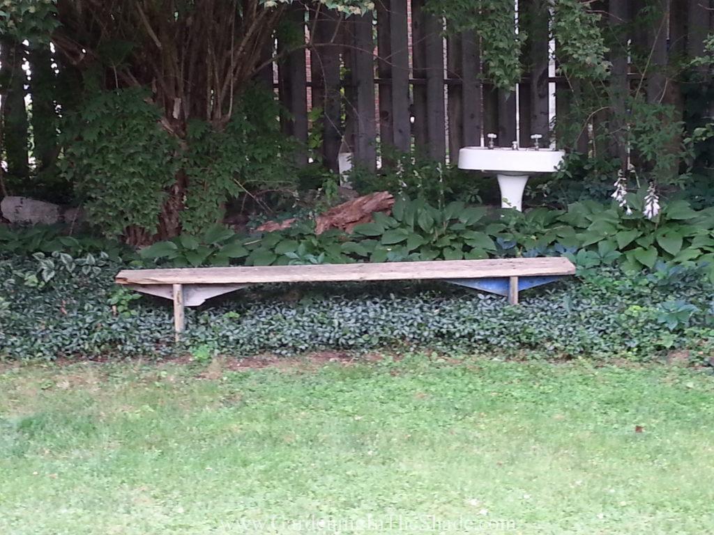 shady garden with old fashioned pedestal sink - Gardening in the Shade